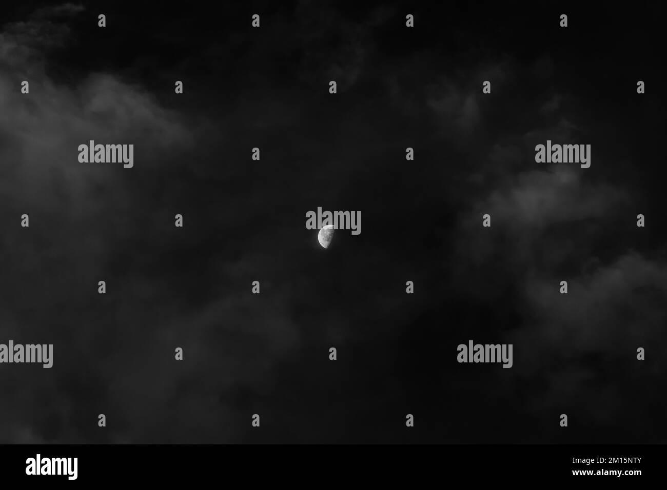 A beautiful view of the third-phase moon appearing in the dark black ...