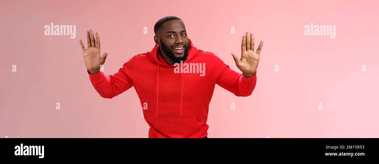 Happy charming outgoing african american male model raise hands joking ...