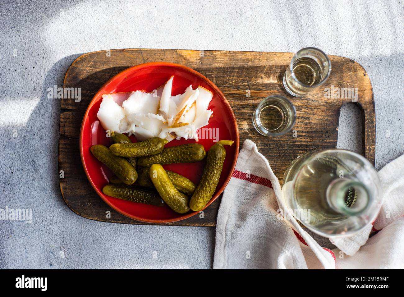 From above glasses of cold vodka drink served with salo and fermented ...