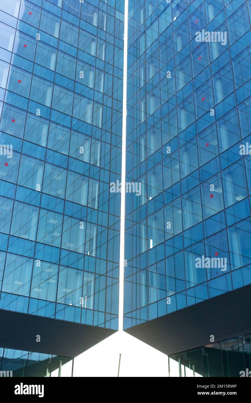 Exterior corners of closely built skyscrapers with glass shiny windows ...