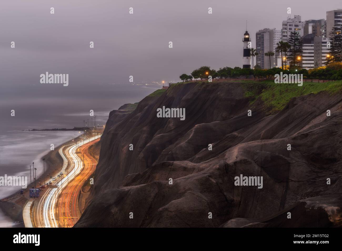 Long exposure shot of Miraflores boardwalk and curvy road with trails ...