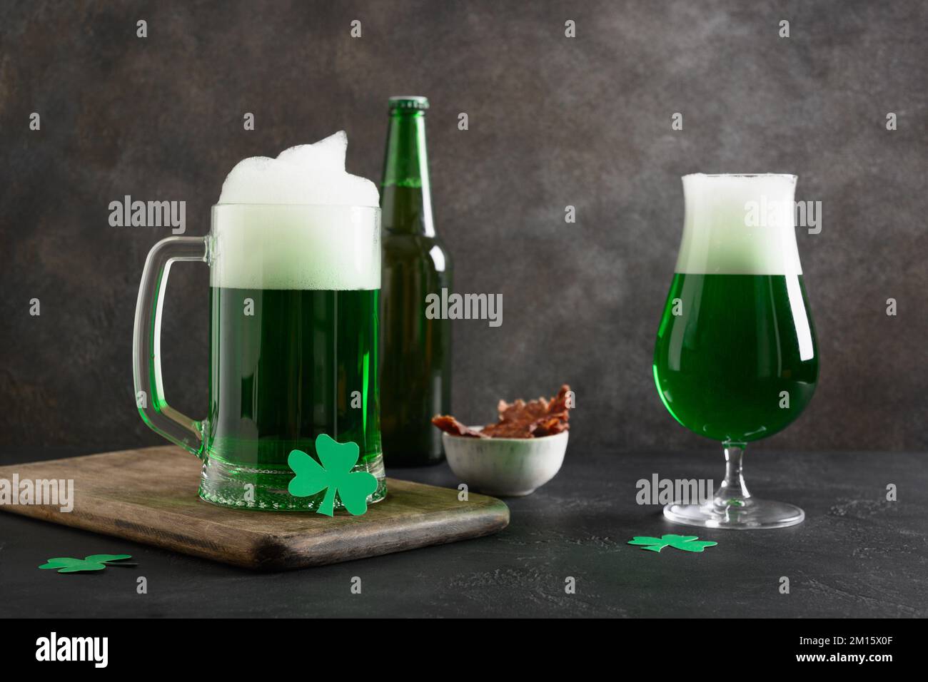 Patrick's day green beer in pint , snack and jerky meat on dark ...