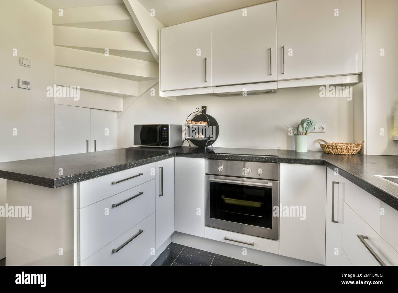 Counters with appliances located against wall with built in furniture ...