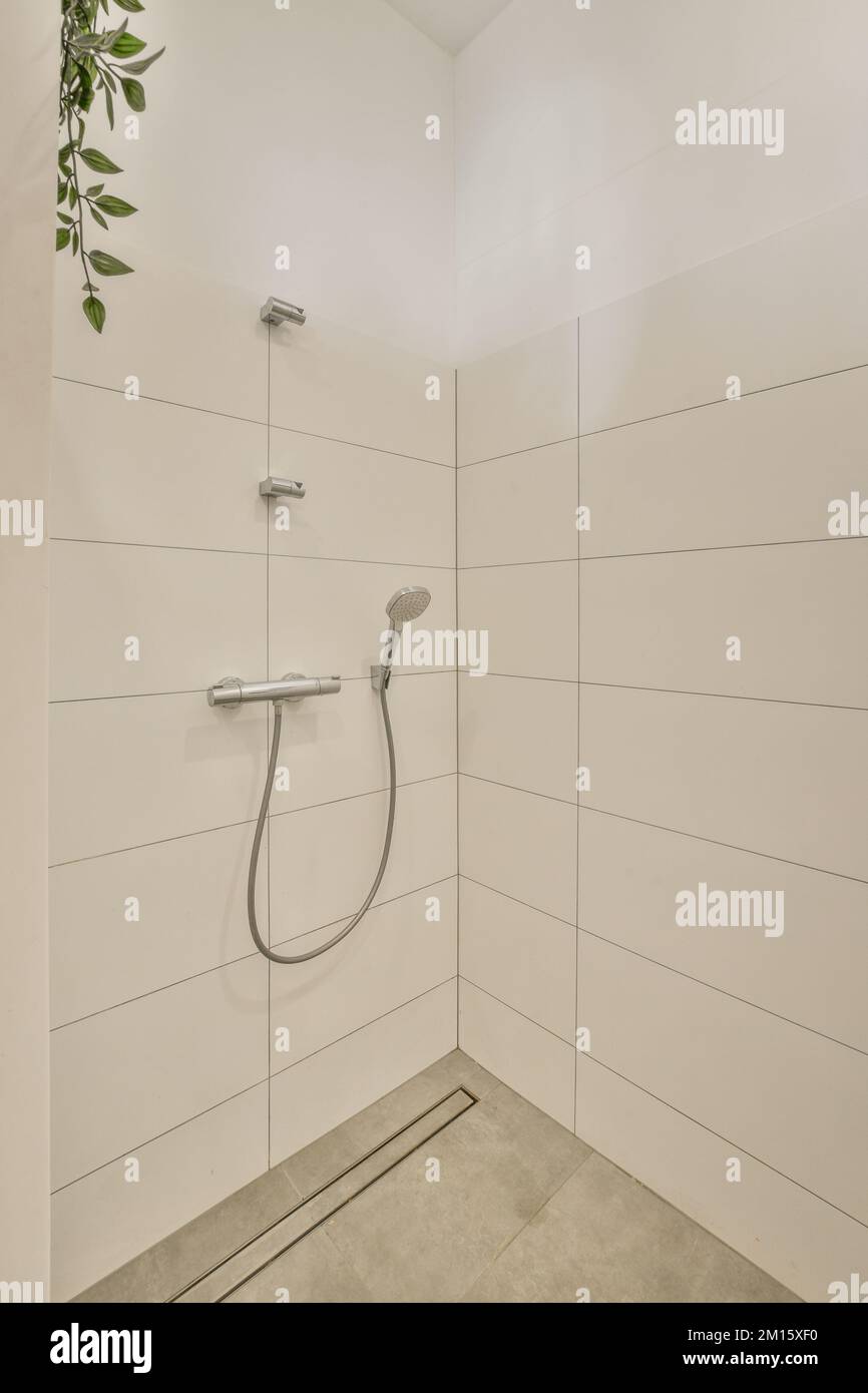 Interior of a modern shower with white walls Stock Photo - Alamy