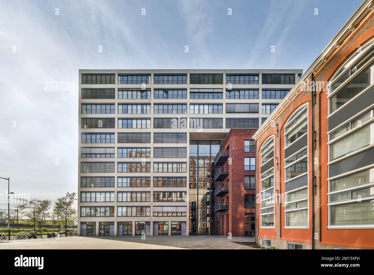 In perspective modern building under a sky with clouds Stock Photo - Alamy