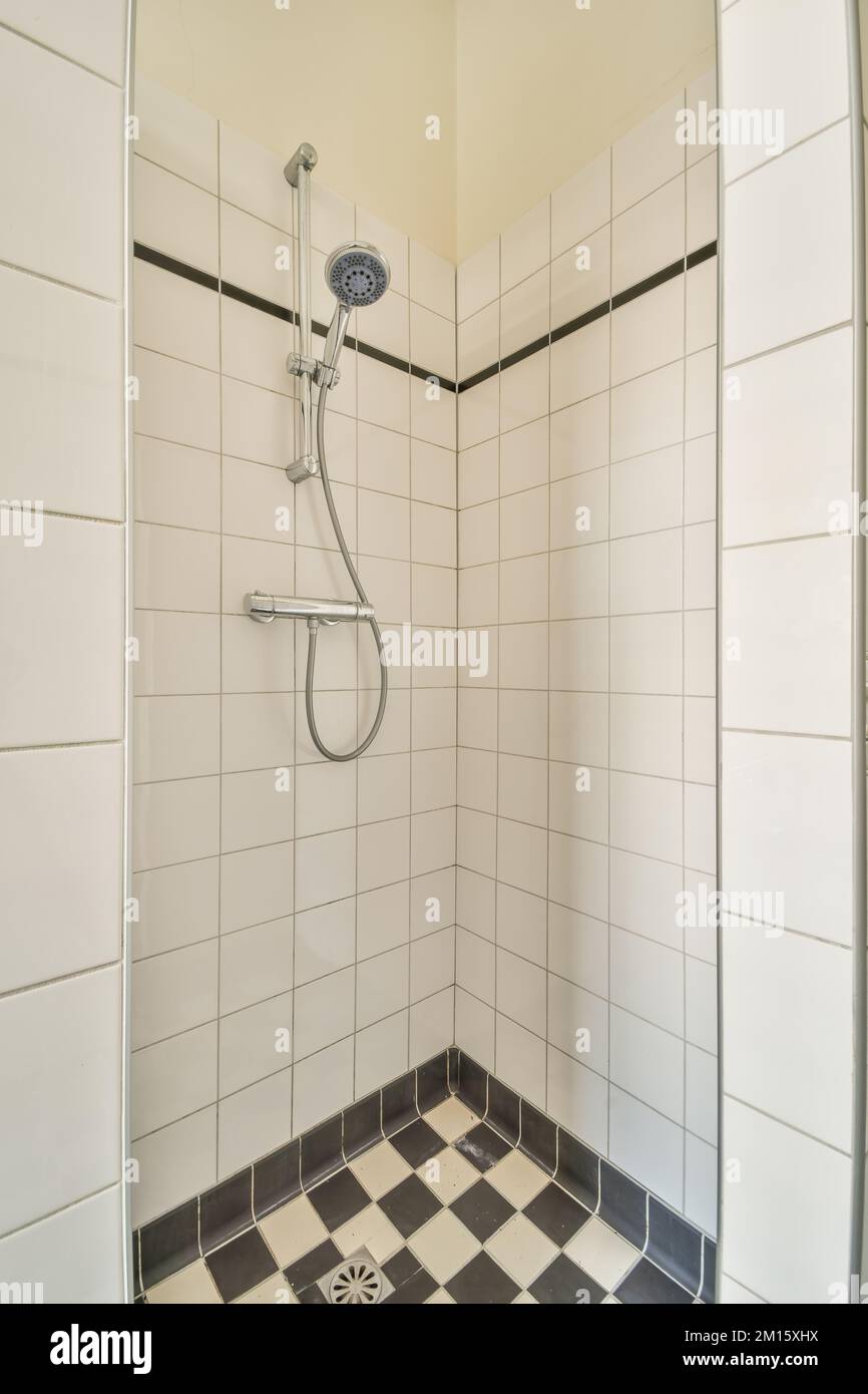 Light empty shower cabin with metal set in modern bathroom with white ...