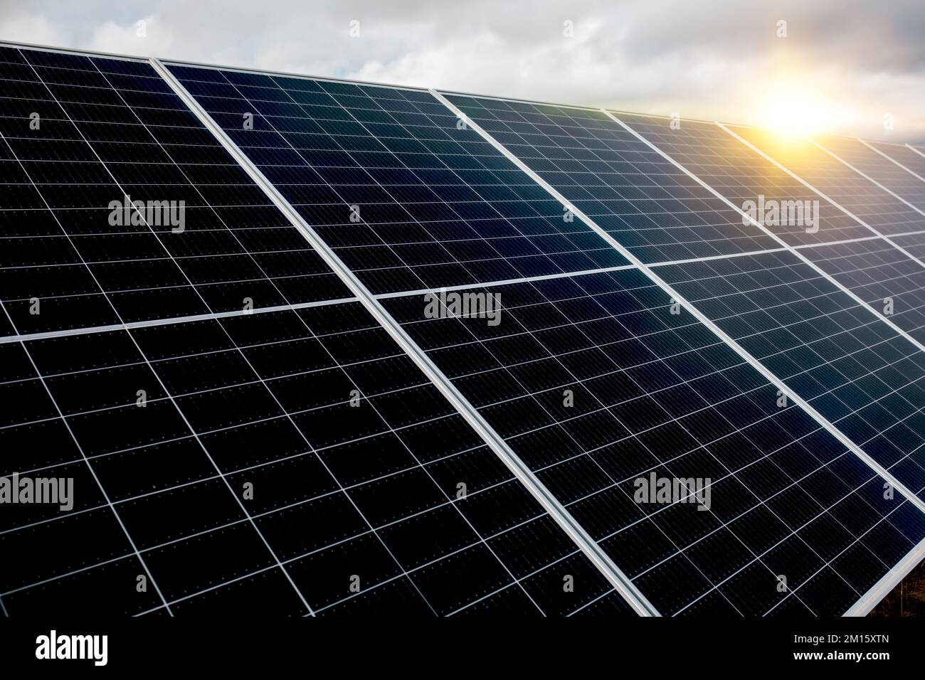 Surface of solar panels on photovoltaic power station against cloudy ...