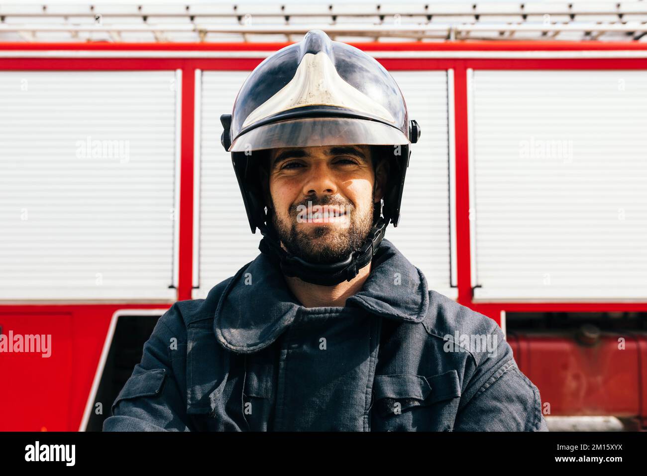 Portrait fireman helmet near fire hi-res stock photography and images ...