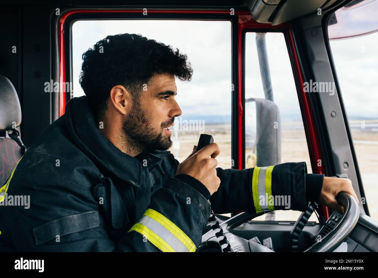Male firefighter speaking on radio hi-res stock photography and images ...