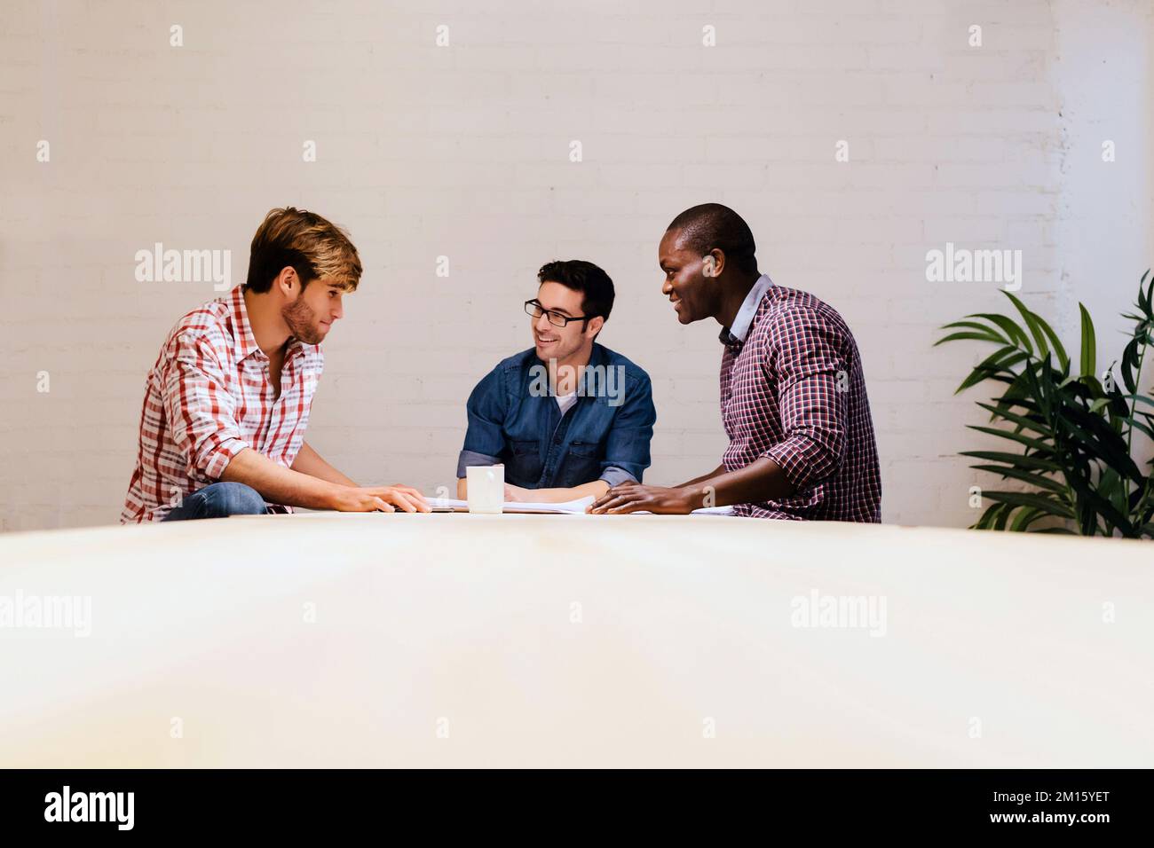 Three Architects and engineers working at the Office Stock Photo - Alamy