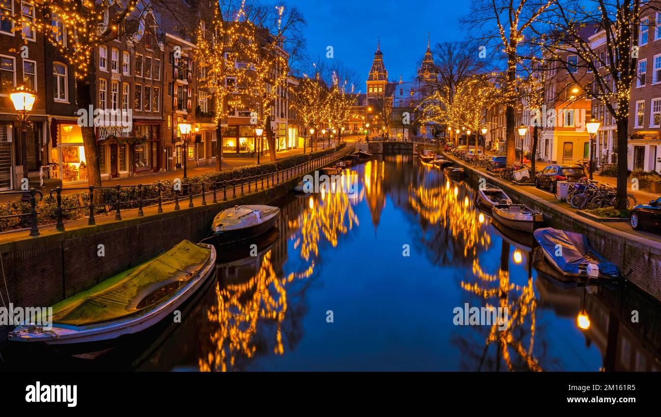 Christmas in Amsterdam canals with Christmas lights during December ...