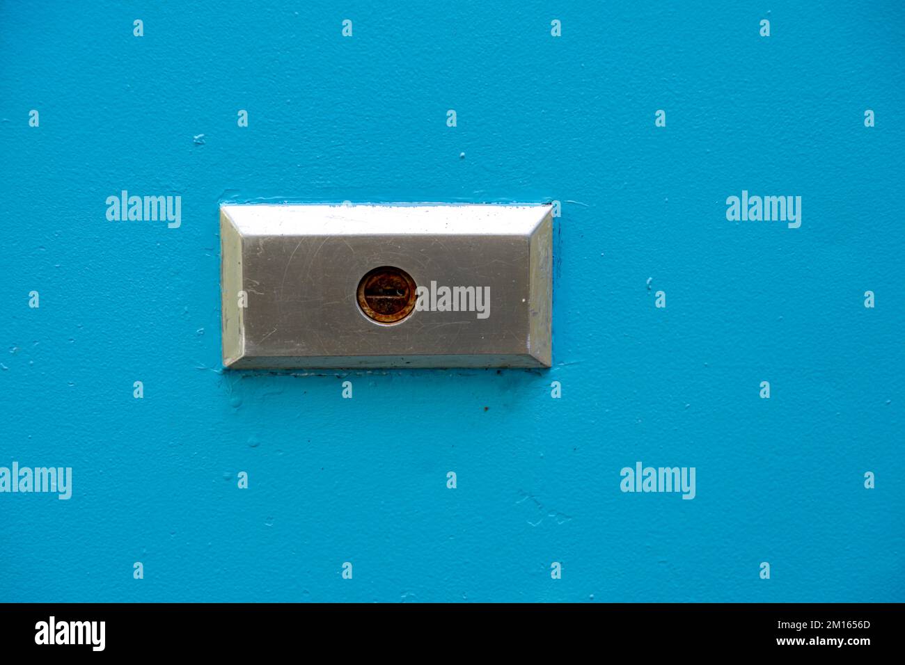 closeup of a blue metal door with a silver keyhole Stock Photo - Alamy