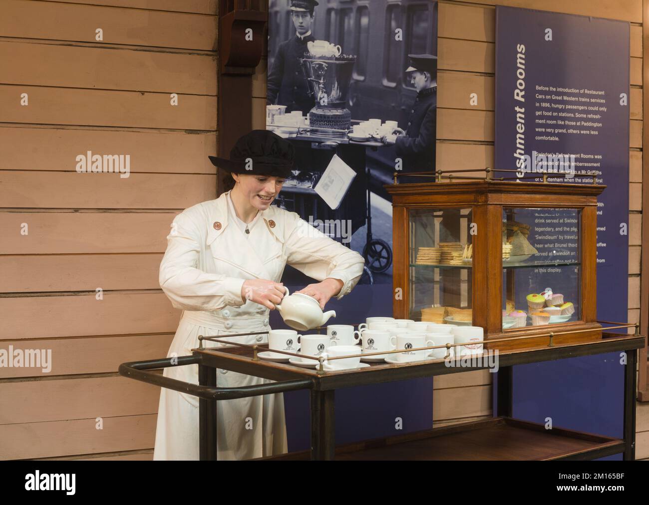 Recreation of waitress serving tea in refreshment room at Swindon steam ...