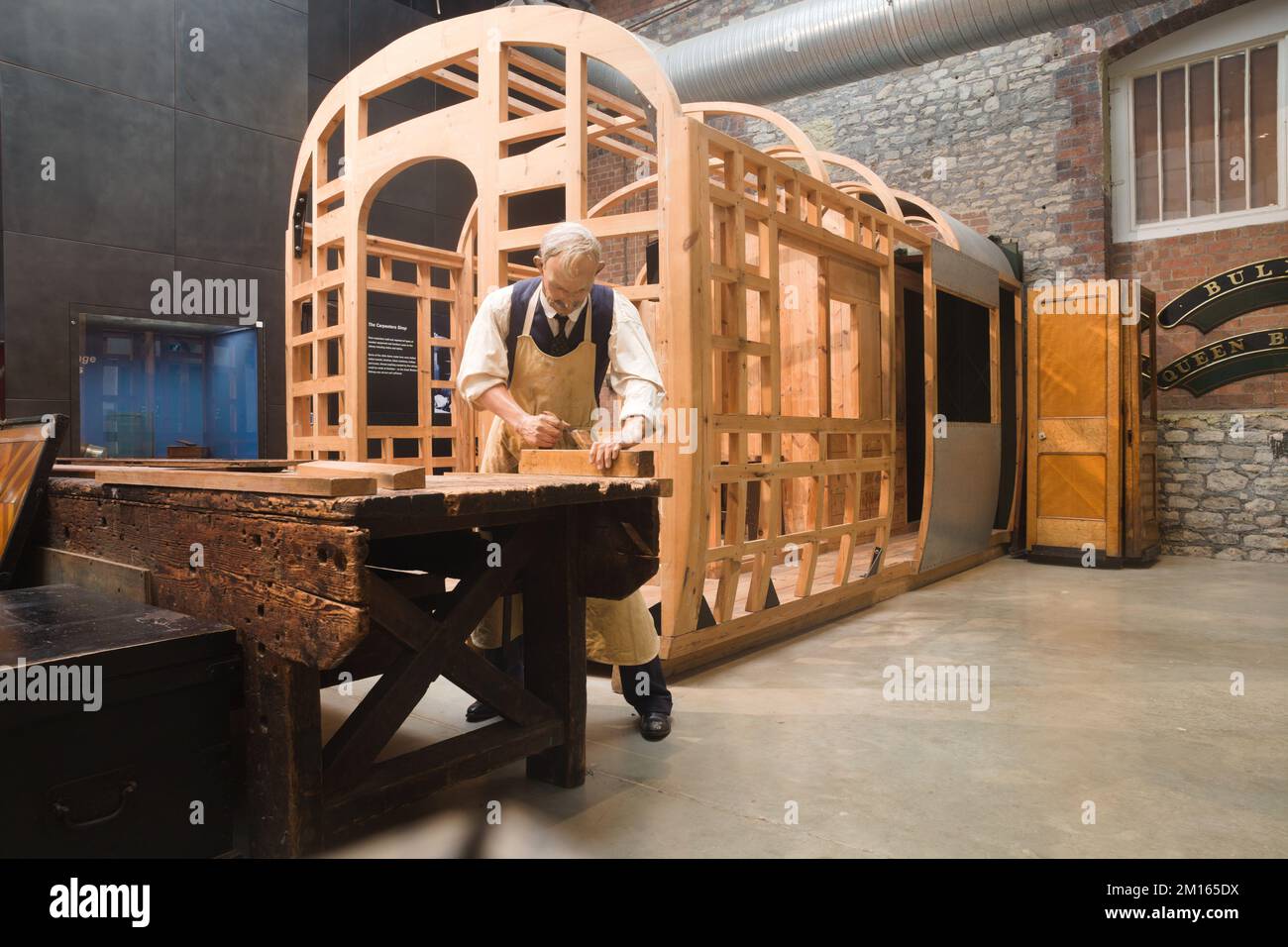 Model of man working on wooden frame of railway carriage at Swindon ...