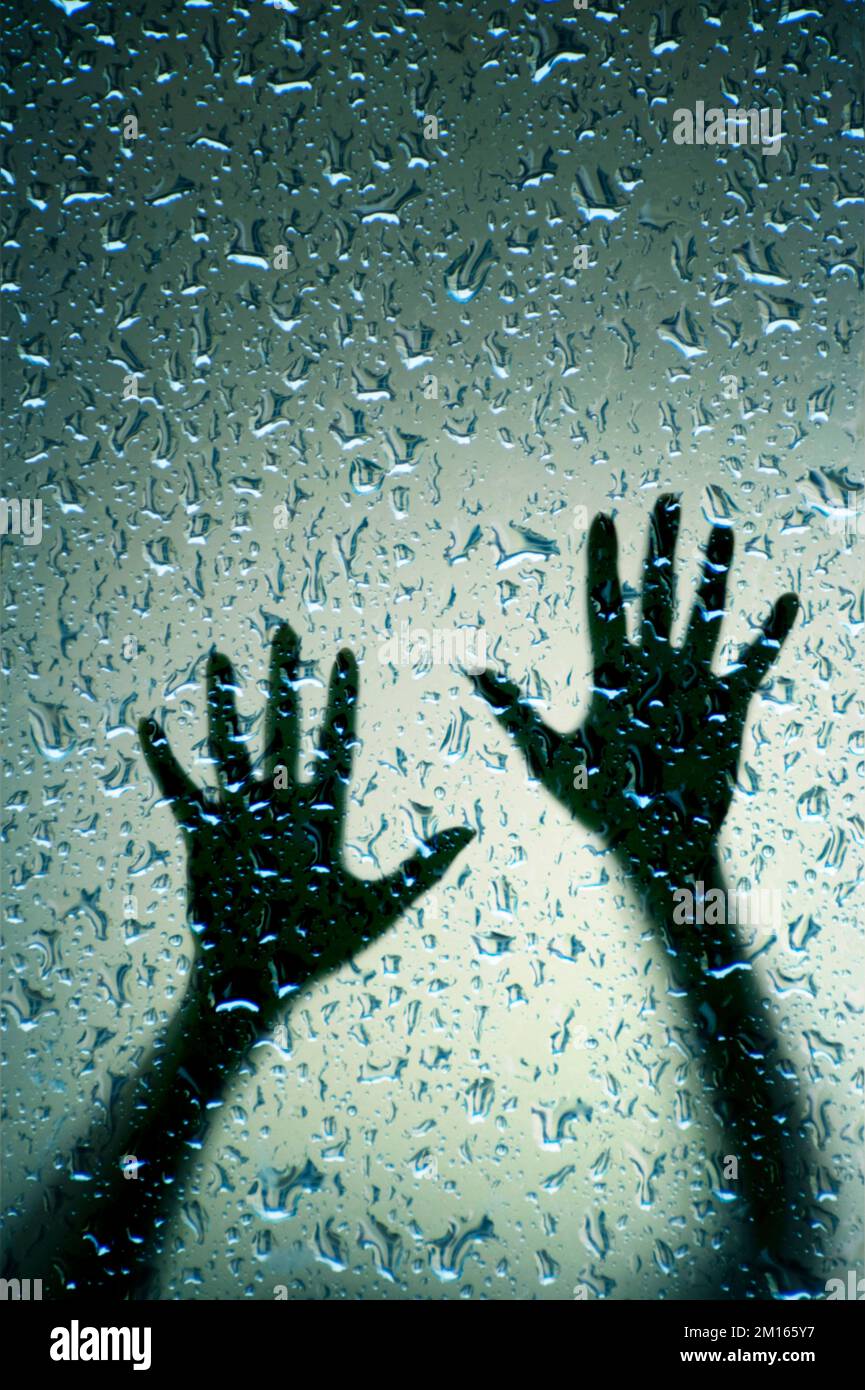 woman hands behind a window with drops of water Stock Photo - Alamy