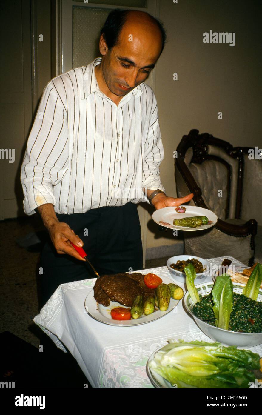 Beirut Lebanon Man Serving Dinner At Home Stock Photo - Alamy