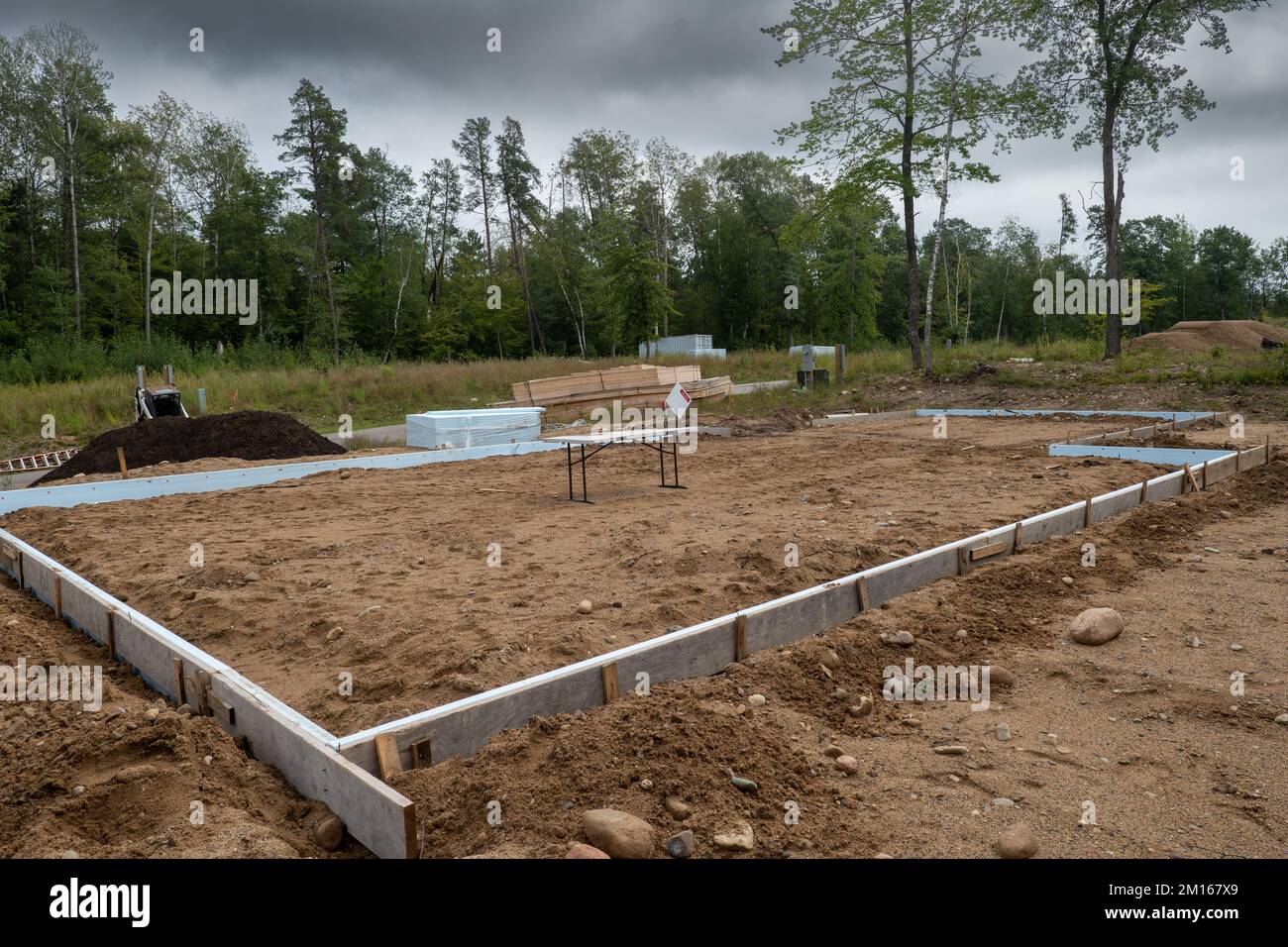 New home construction job site with wood forms in place for concrete ...