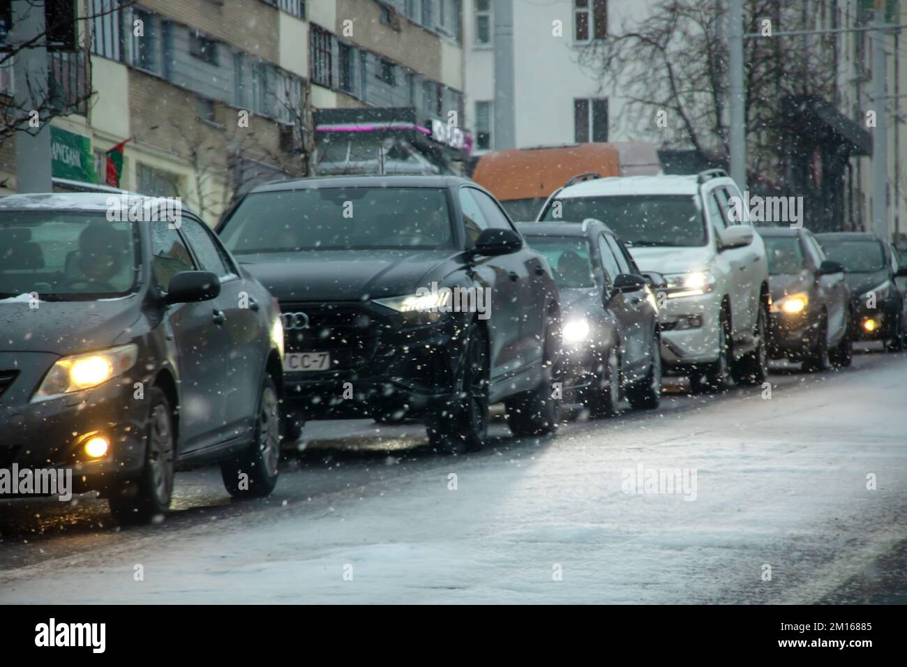Belarus, Minsk - 19 october, 2022: Cars in a snow storm in traffic in ...