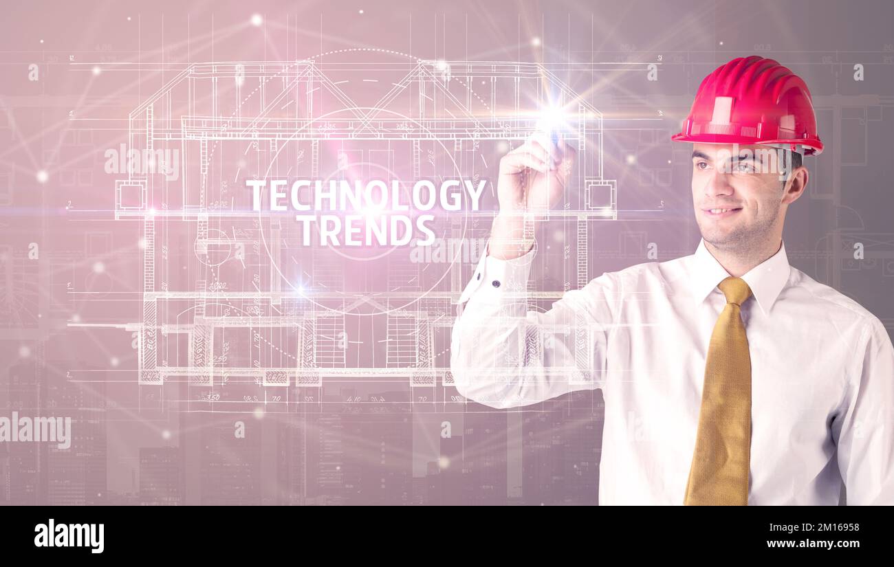 Handsome architect drawing with helmet Stock Photo - Alamy