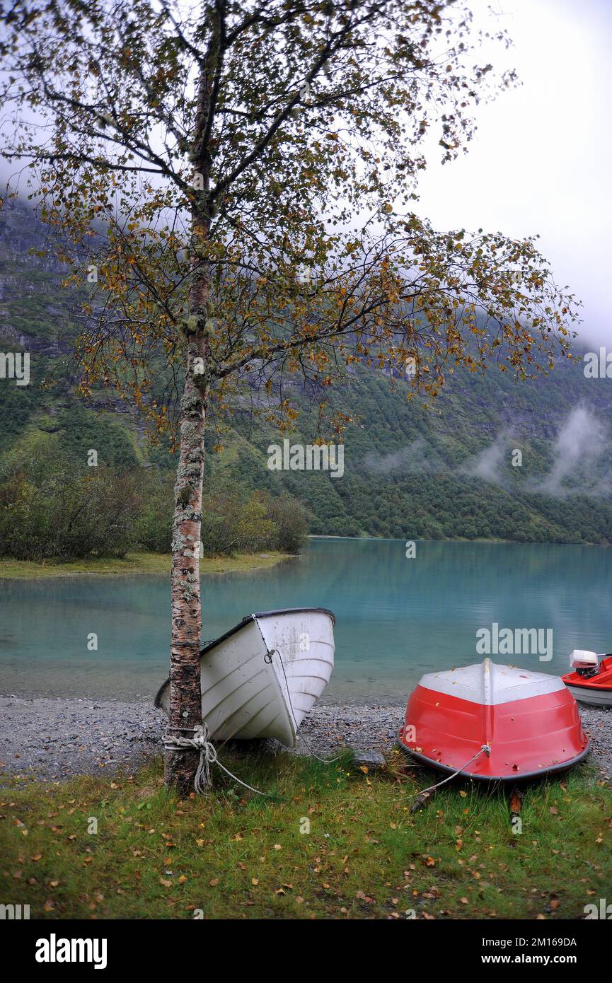 Small boats on the shore line of Lovatnet / Lake Loen Stock Photo - Alamy