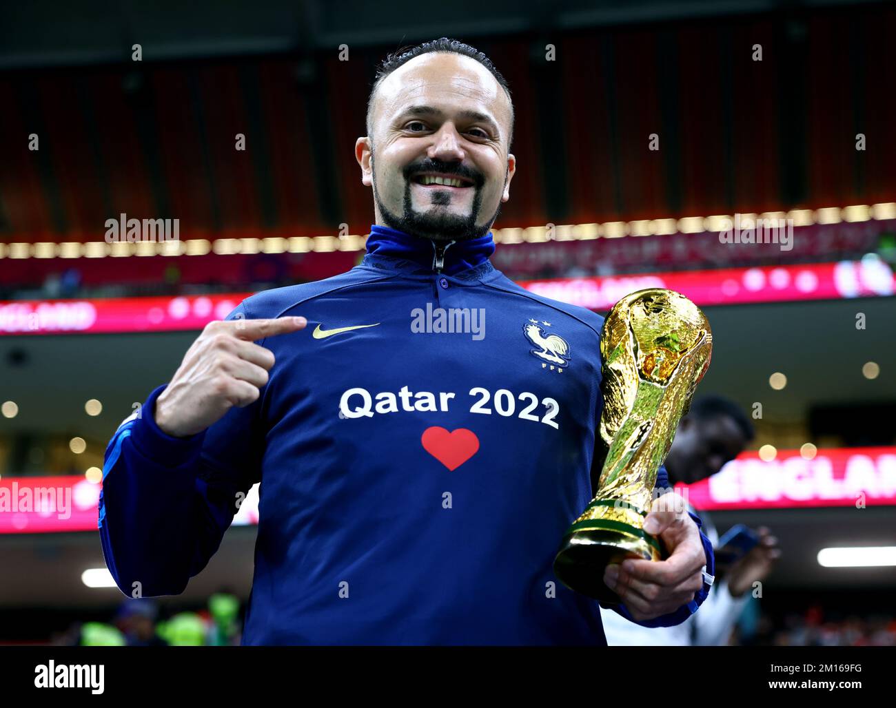 Al Khor, Qatar, 10th December 2022. French fan with replica trophy ...