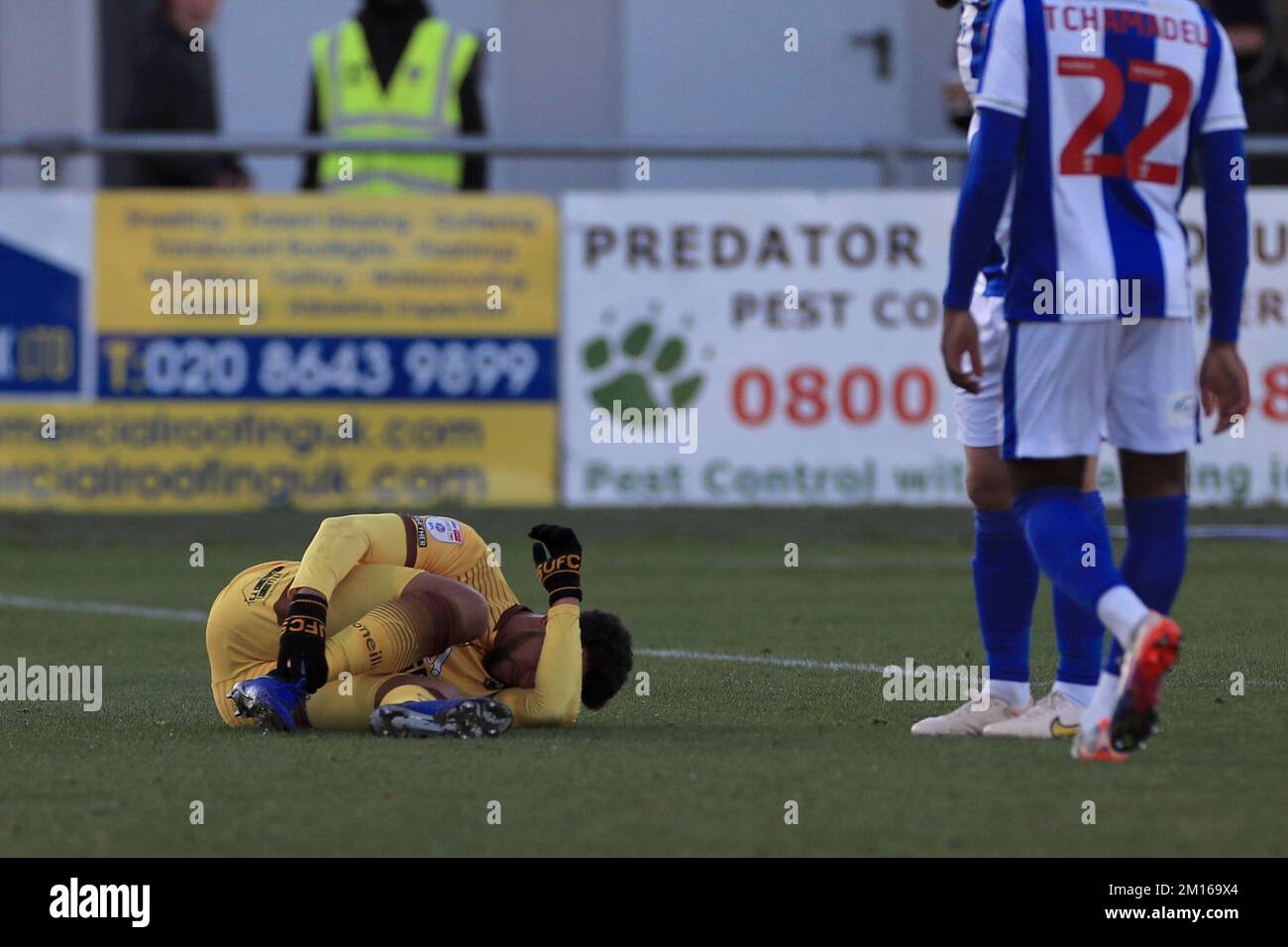 Sutton, UK. 10th Dec, 2022. Donovan Wilson of Sutton United is down ...