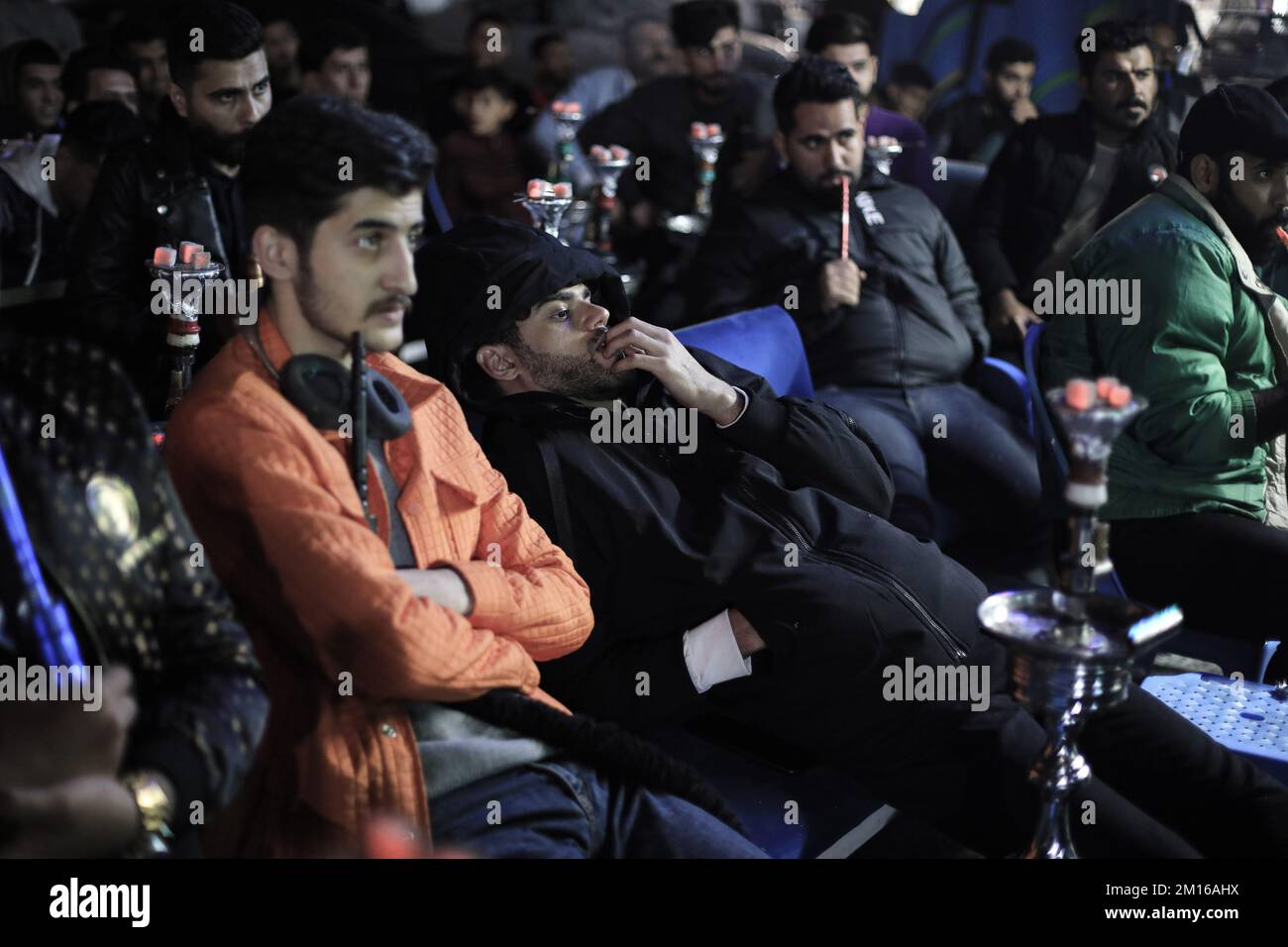 Baghdad, Iraq. 10th Dec, 2022. Iraqis watch the FIFA World Cup Qatar ...