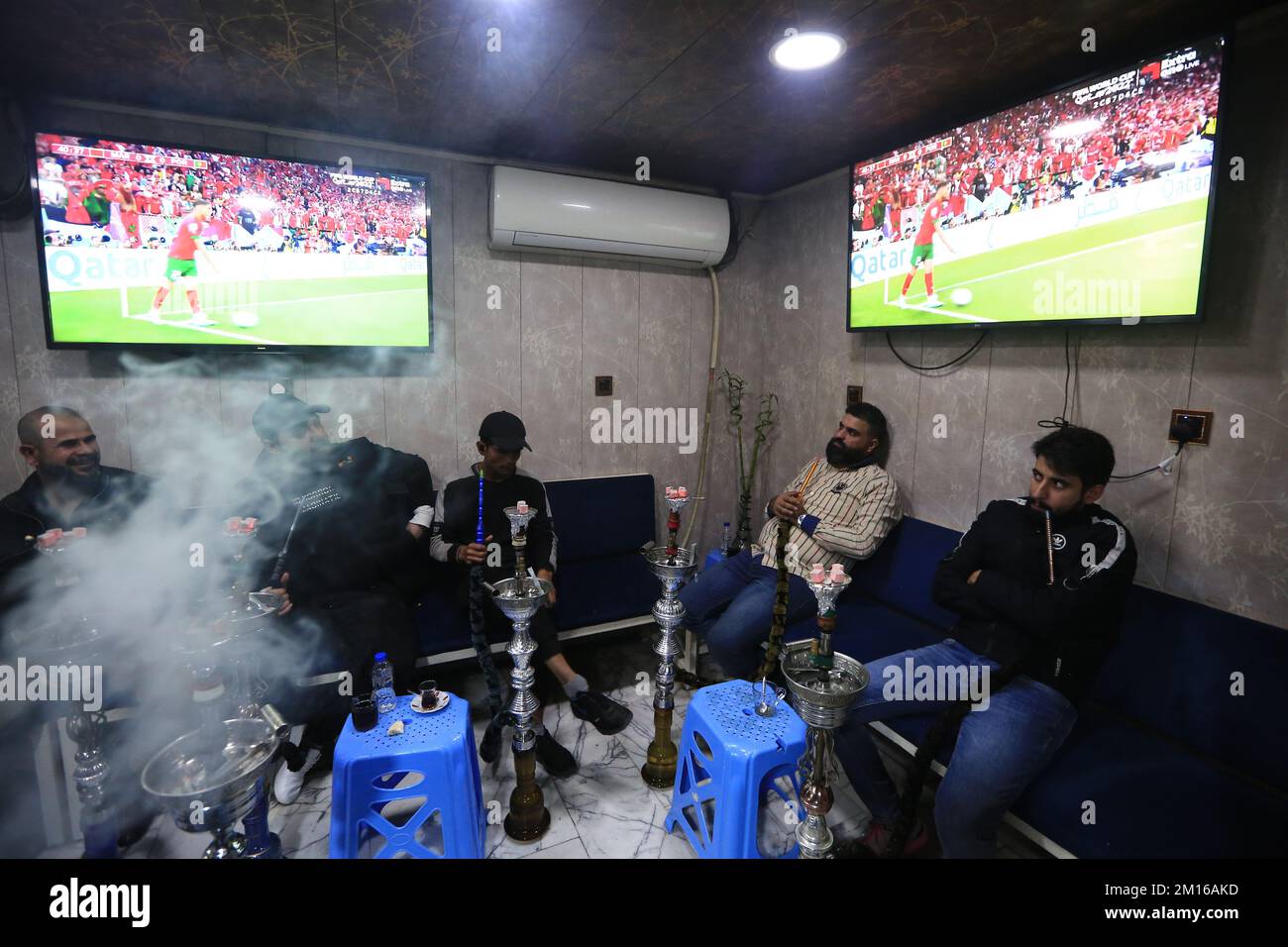 Baghdad, Iraq. 10th Dec, 2022. Iraqis watch the FIFA World Cup Qatar ...