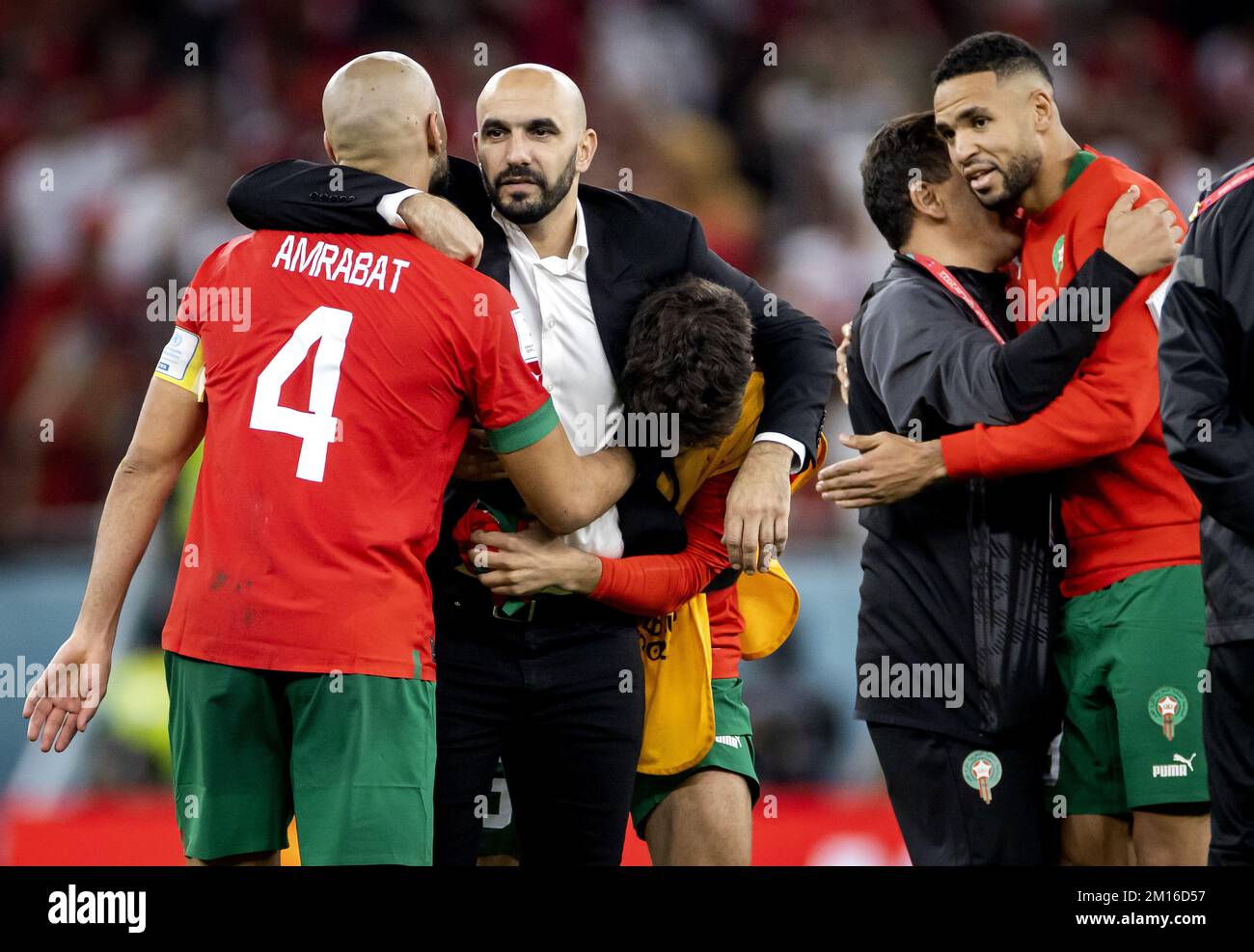 DOHA - Sofyan Amrabat of Morocco and Morocco coach Walid Regragui after the FIFA World Cup Qatar ...