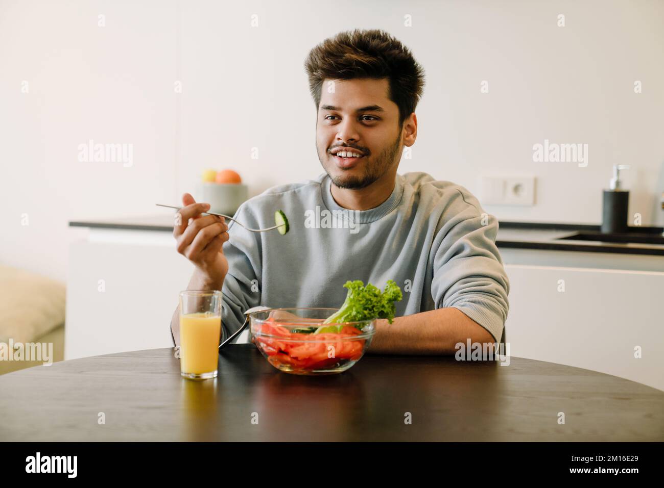 Indian man eating home hi-res stock photography and images - Alamy