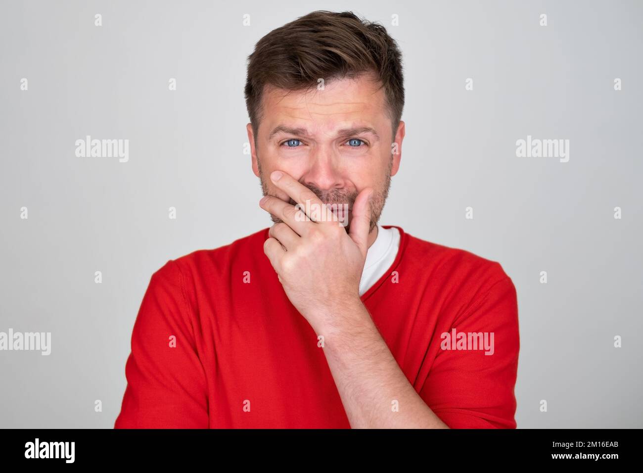 upset crying man in red sweater. Do not be shy to cry concept Stock ...