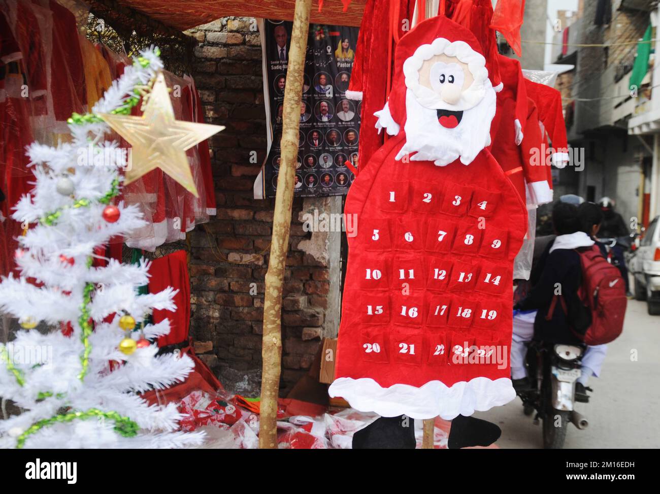 ISLAMABAD, PAKISTAN.A vendor is displaying and selling Santa Claus ...