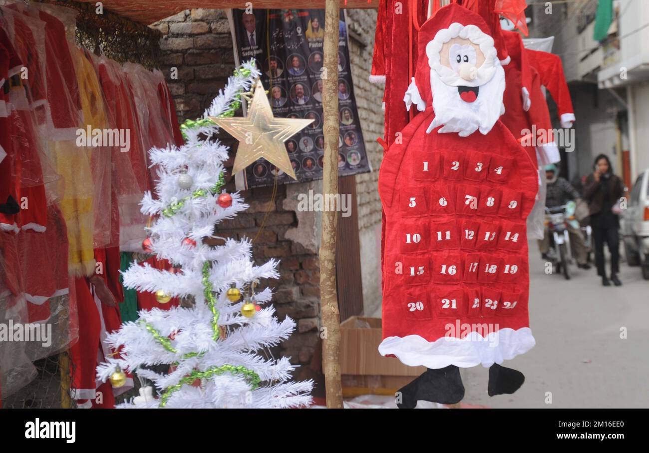 ISLAMABAD, PAKISTAN.A vendor is displaying and selling Santa Claus ...