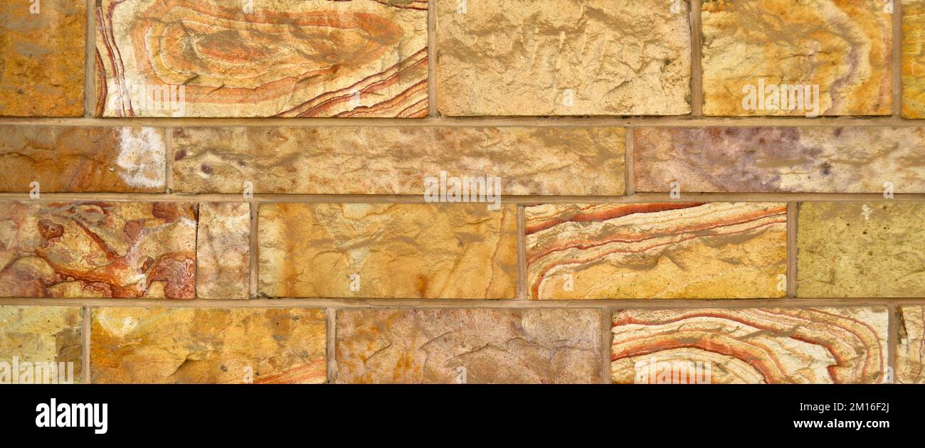 Sturdy yellow and beige cut stone wall, good for backgrounds, seamless ...