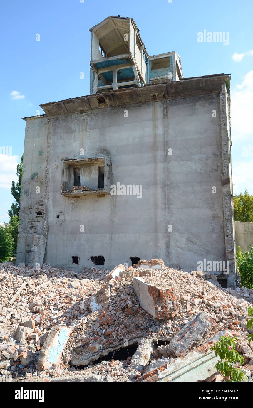 Collapsed industrial multistorey building in daytime. Disaster scene ...