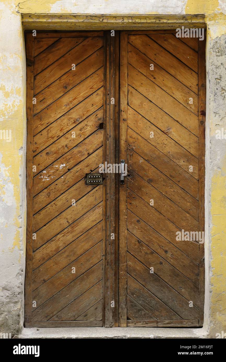 Old ancient wooden door texture in european medieval style. The ...