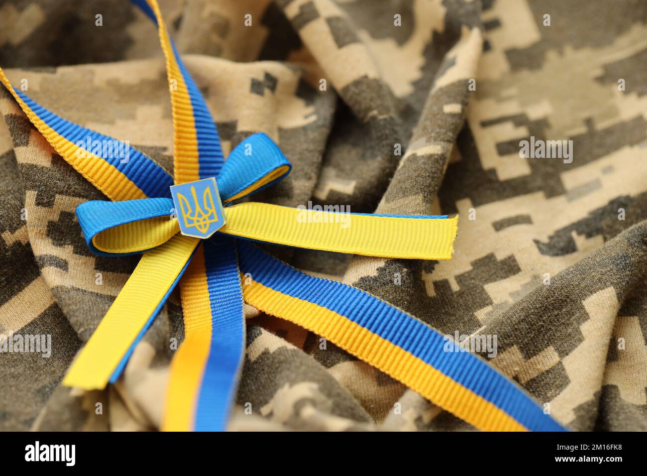 Pixeled digital military camouflage fabric with ukrainian flag and coat ...