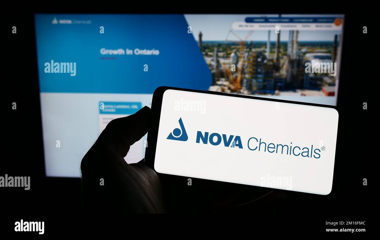 Person holding mobile phone with logo of Canadian company NOVA ...