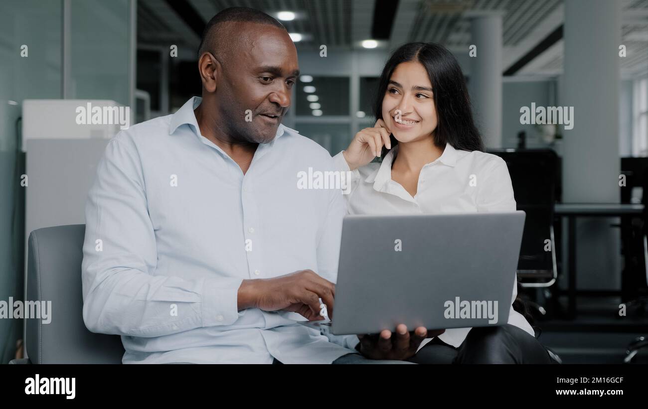 Diverse colleagues two business partners african arabian co-workers ...