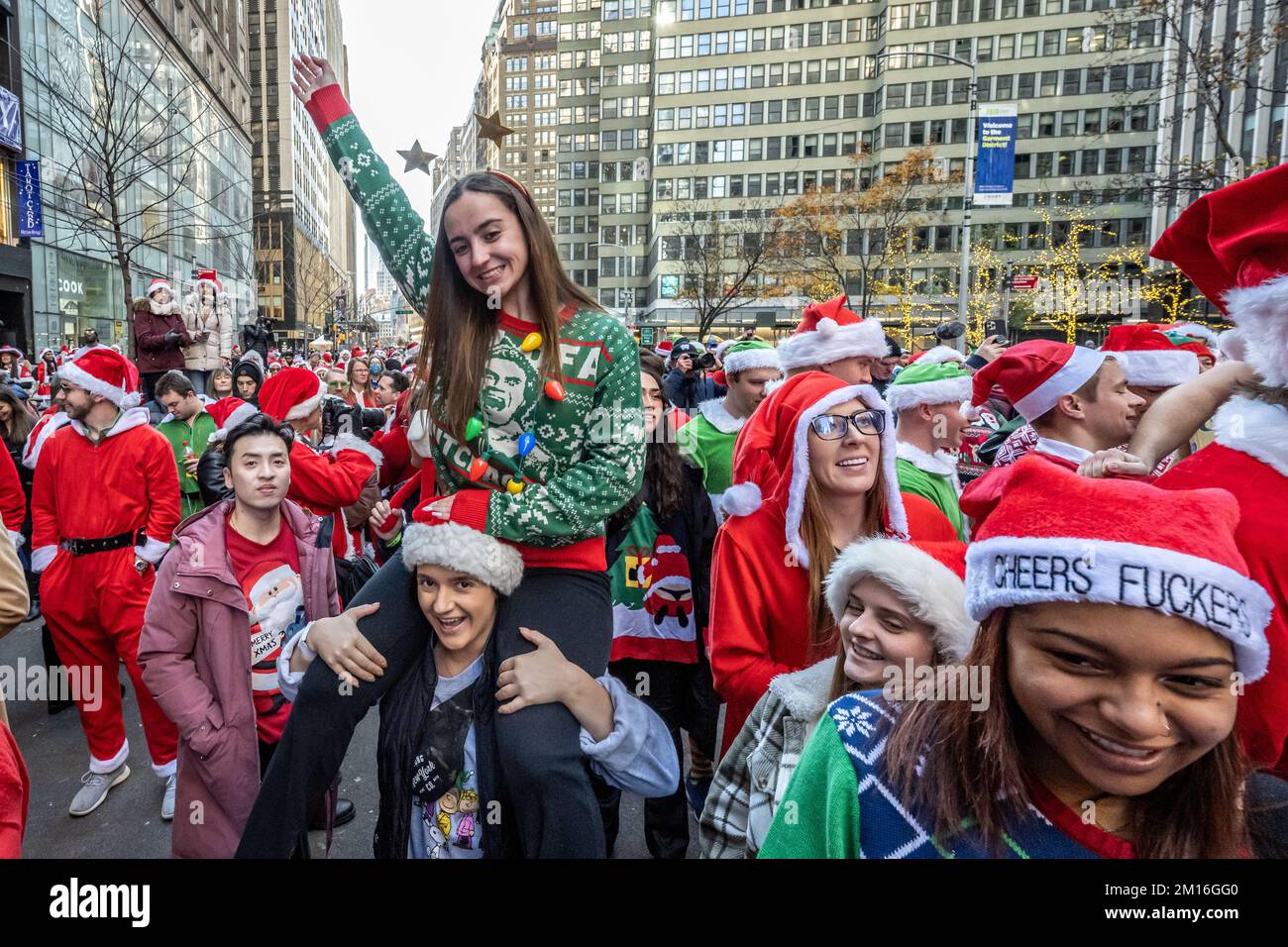 New York, USA. 10th Dec, 2022. Revelers dressed as Santa Claus have fun ...
