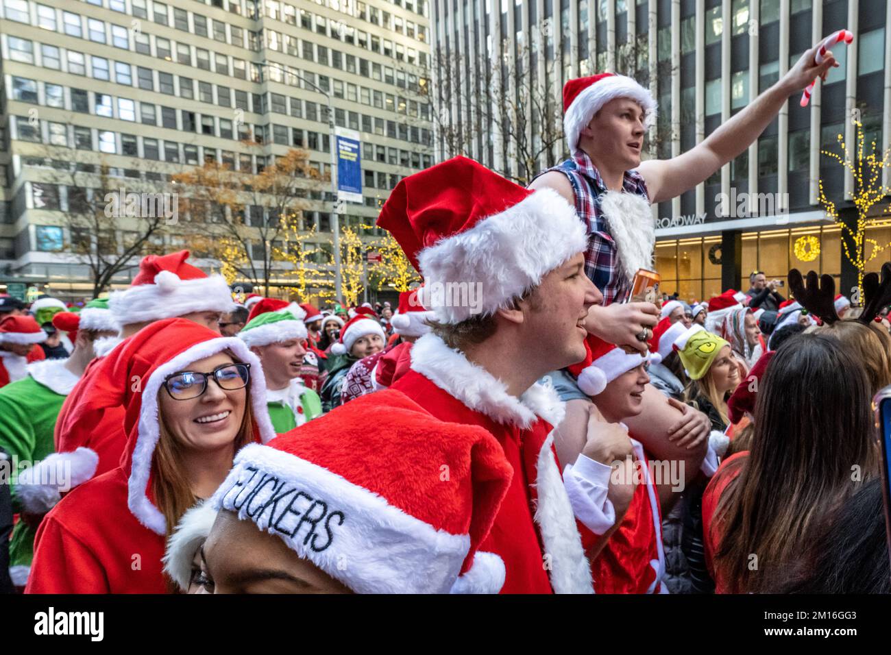 New York, USA. 10th Dec, 2022. Revelers dressed as Santa Claus have fun ...