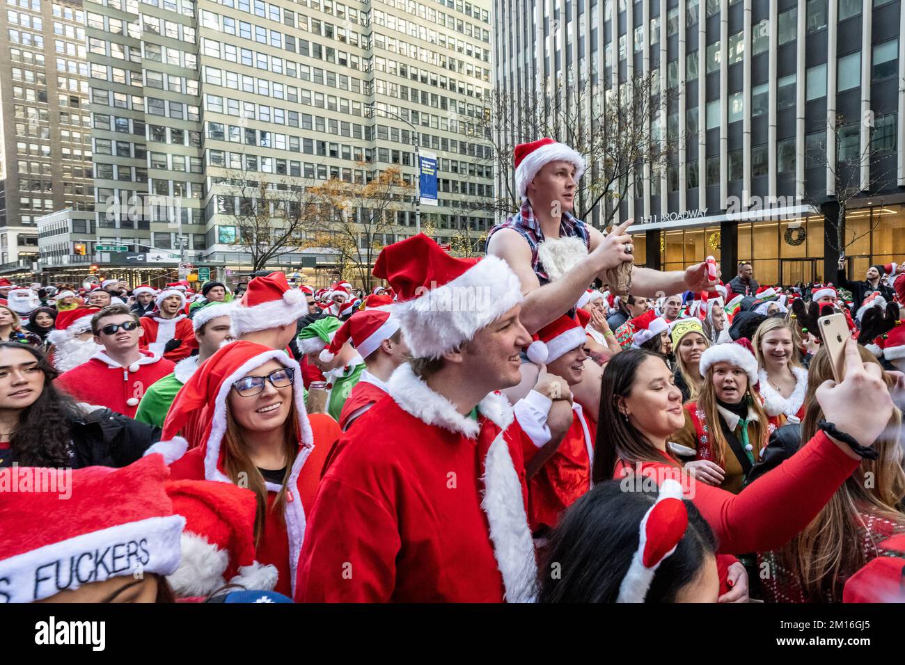 New York, USA. 10th Dec, 2022. Revelers dressed as Santa Claus have fun ...