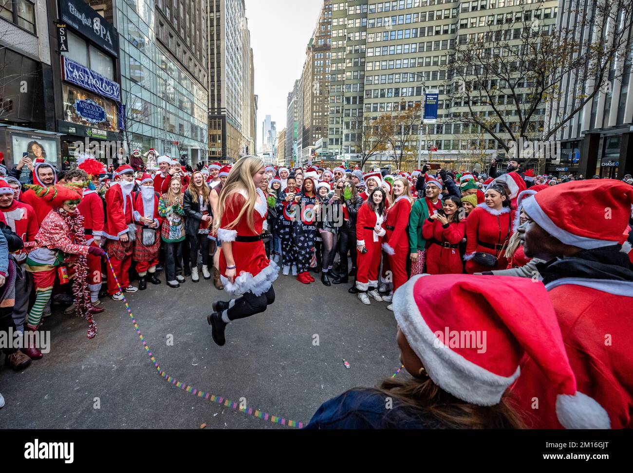 New York, USA. 10th Dec, 2022. Revelers dressed as Santa Claus have fun ...