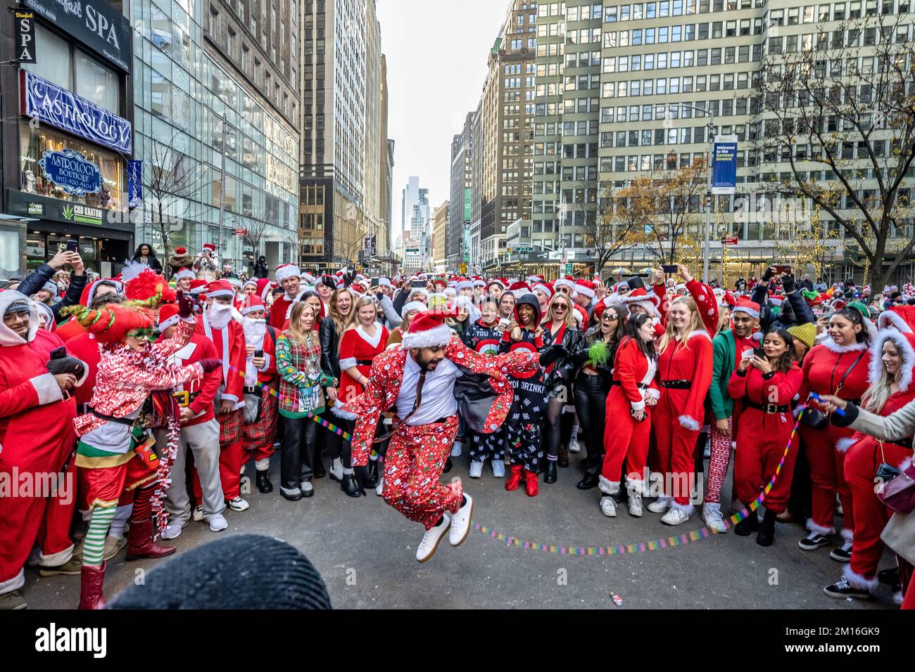 New York, USA. 10th Dec, 2022. Revelers dressed as Santa Claus have fun ...