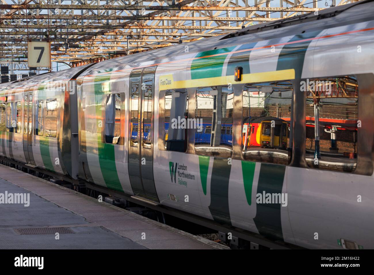 East Midlands Railway class 156 train reflected in the window of a West ...