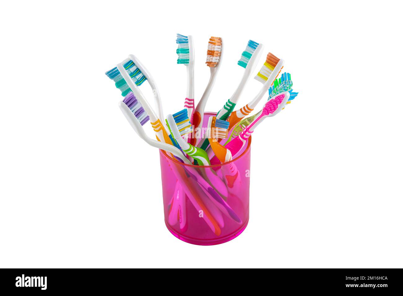 Toothbrush, toothbrush close-up. Set of toothbrushes in pink glass bowl ...