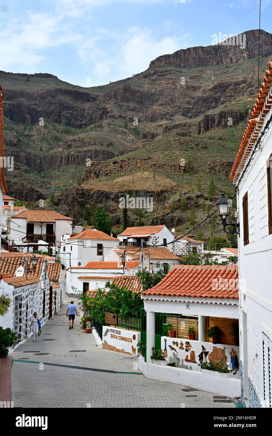 Small narrow street in the mountain village of Fataga with red tiled ...