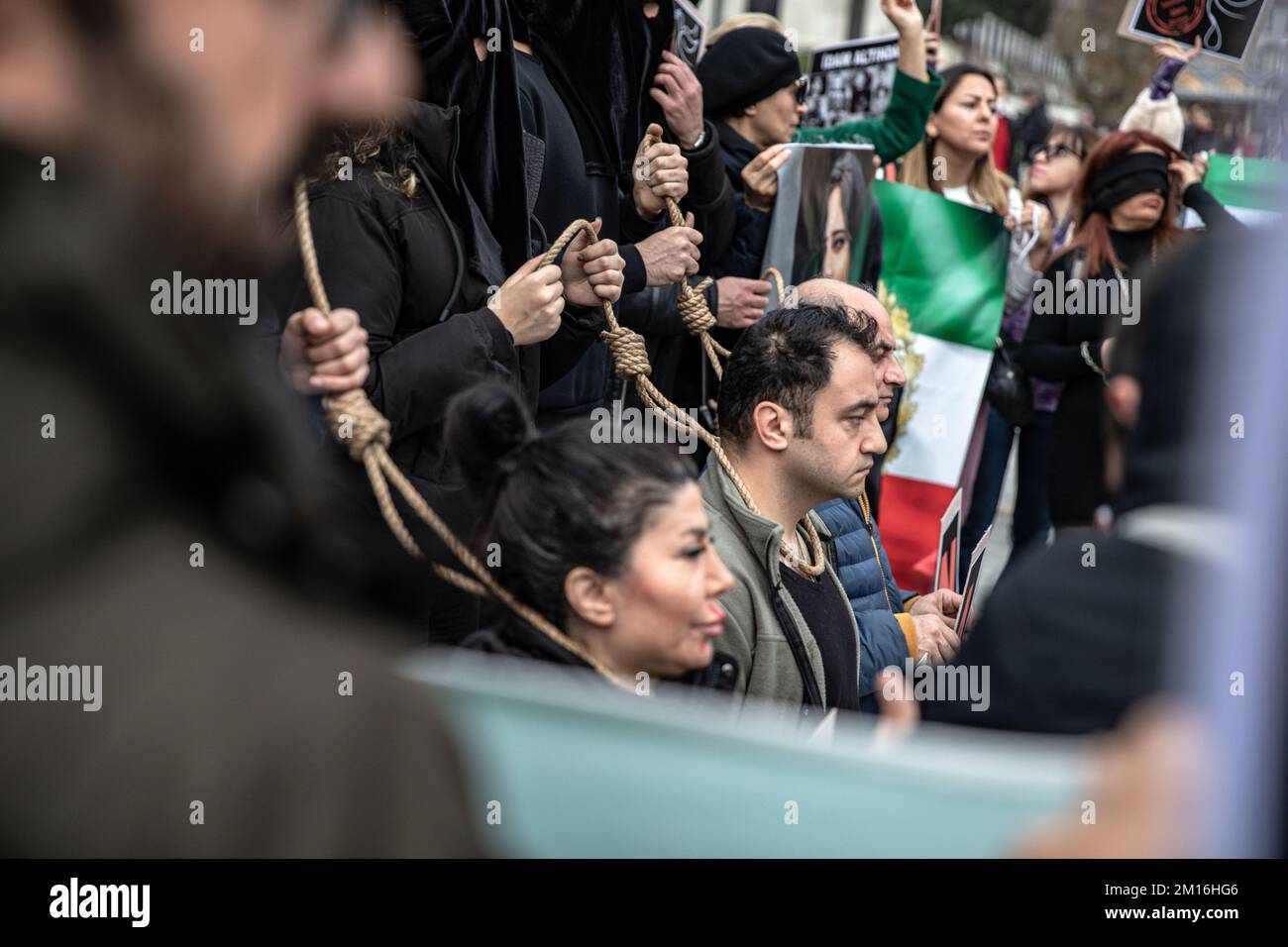 Protesters performed an execution scene with ropes around their necks ...