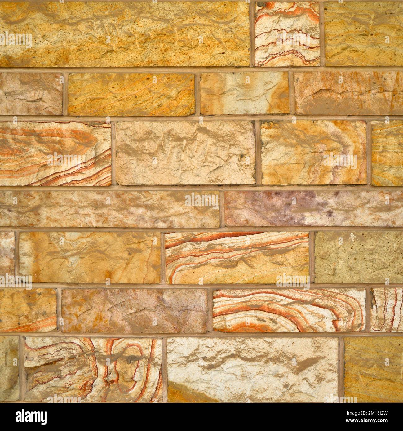 Sturdy yellow and beige cut stone wall, good for backgrounds, seamless ...