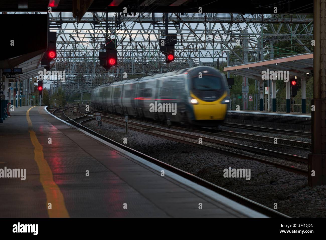 Avanti west Coast class 390 Pendolino train speeding through Crewe ...